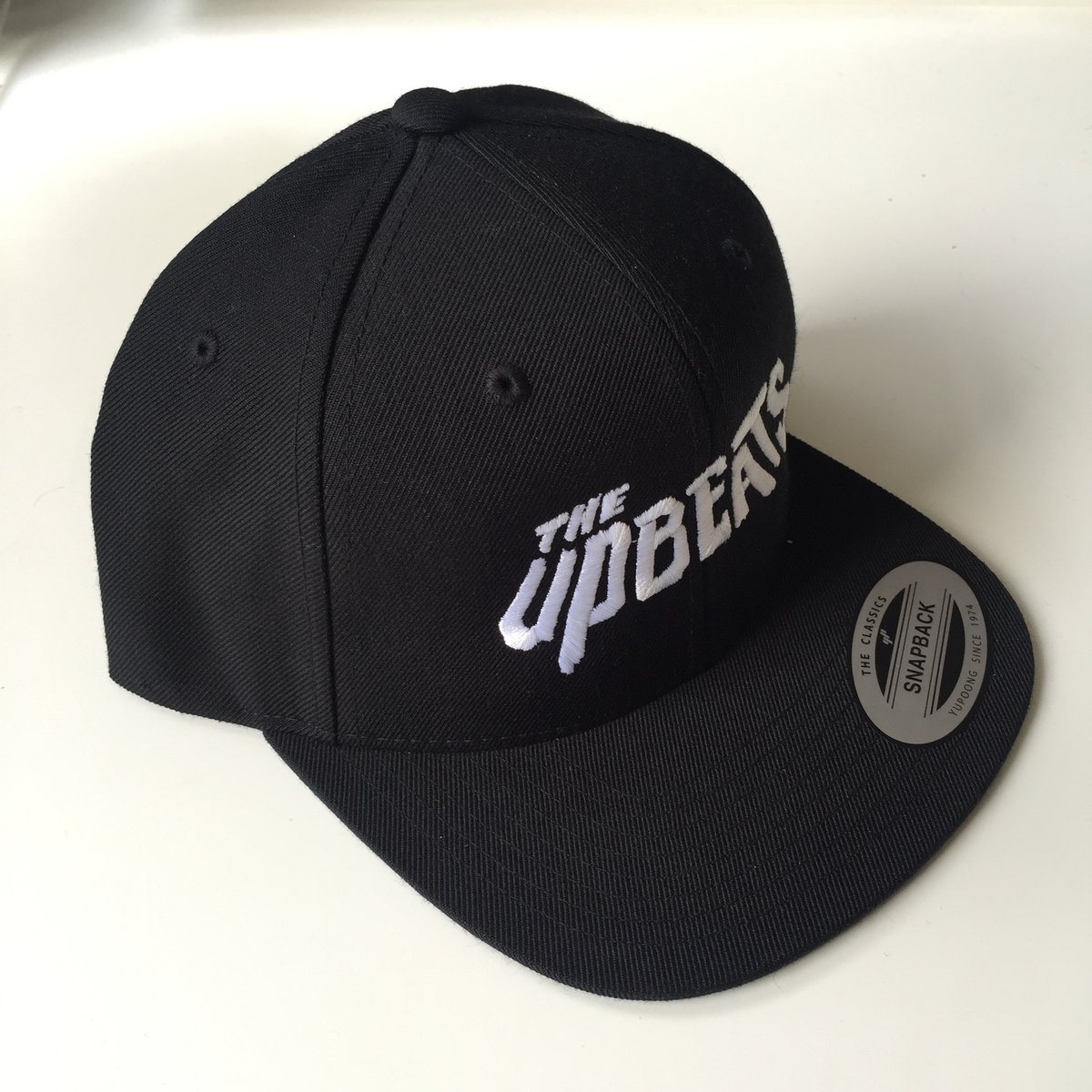 Snap-Back Logo Cap | The Upbeats