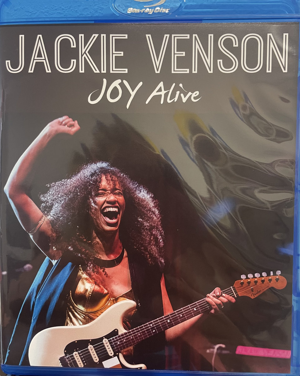 JOY Alive Blu-Ray and black/gold tee | Jackie Venson