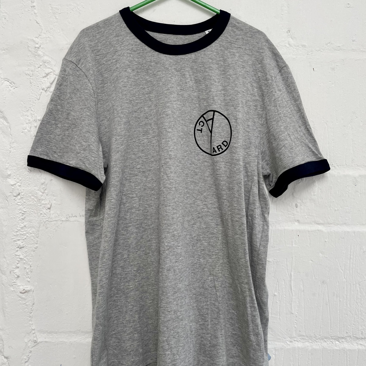 Grey Ringer pocket logo | Yard Act