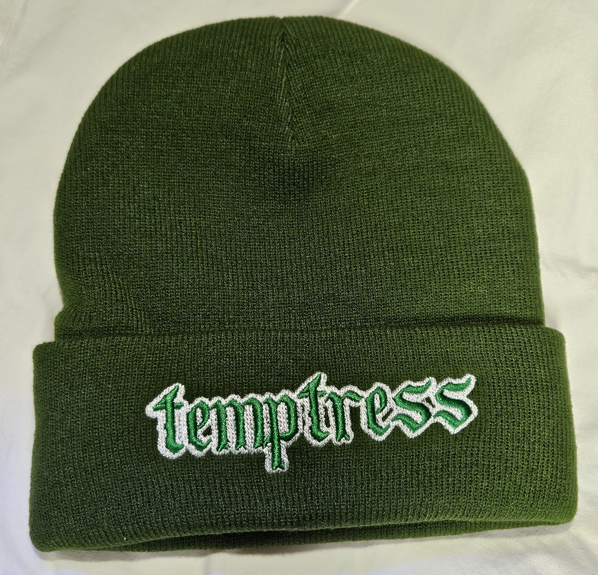 Green embroidered cuffed beanie w/ green font & white highlight | Temptress