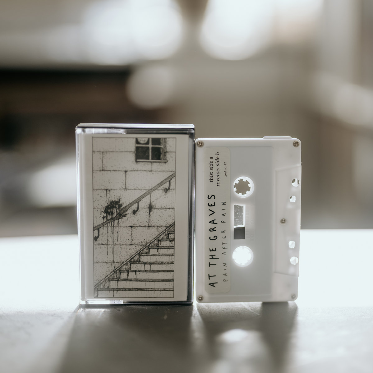 GOD NO. 12: At the Graves - Pain After Pain "Stair" Cassette | godno.