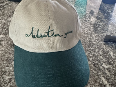 Cursive Logo Hat | celebration guns