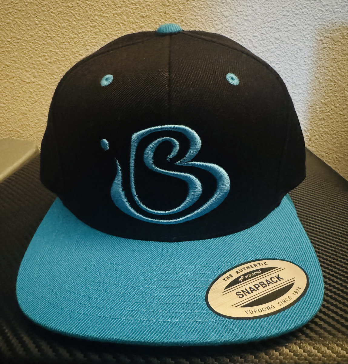 Black/Carolina blue hat with carolina blue logo. | BORED STIFF