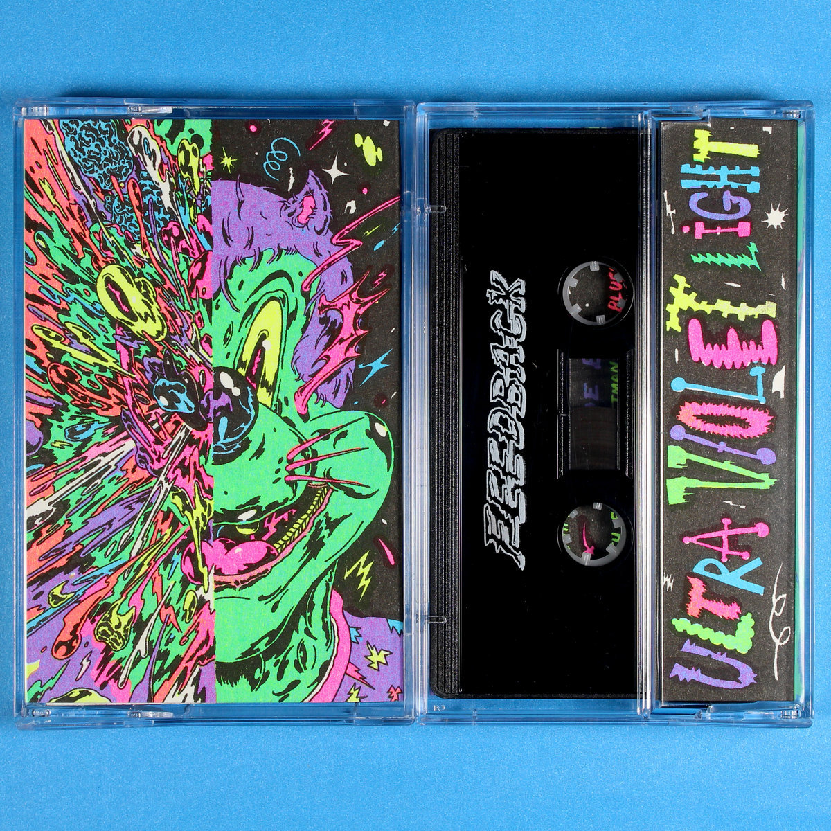 DISTRO ITEM: Various - FEEDBACK compilation CASSETTE (Ultra Violet Light) | Carbon Records