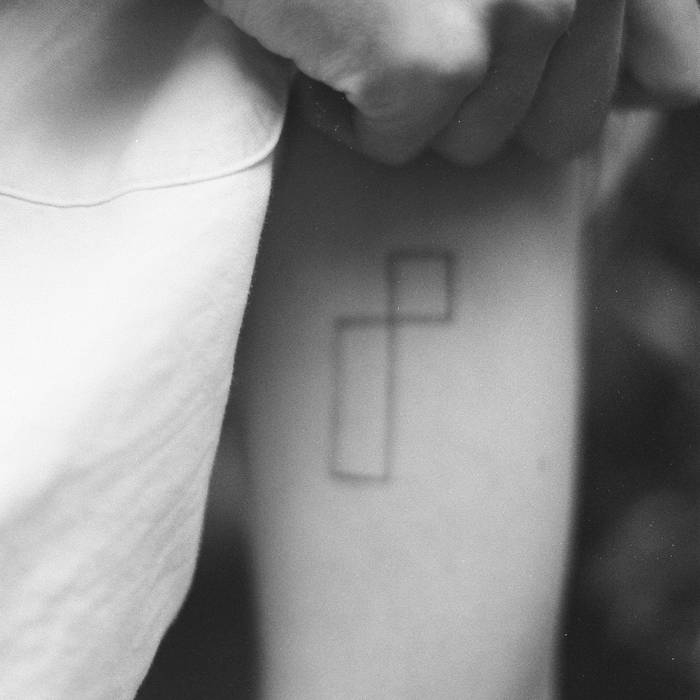 Upside Down Cross Tattoo On Wrist