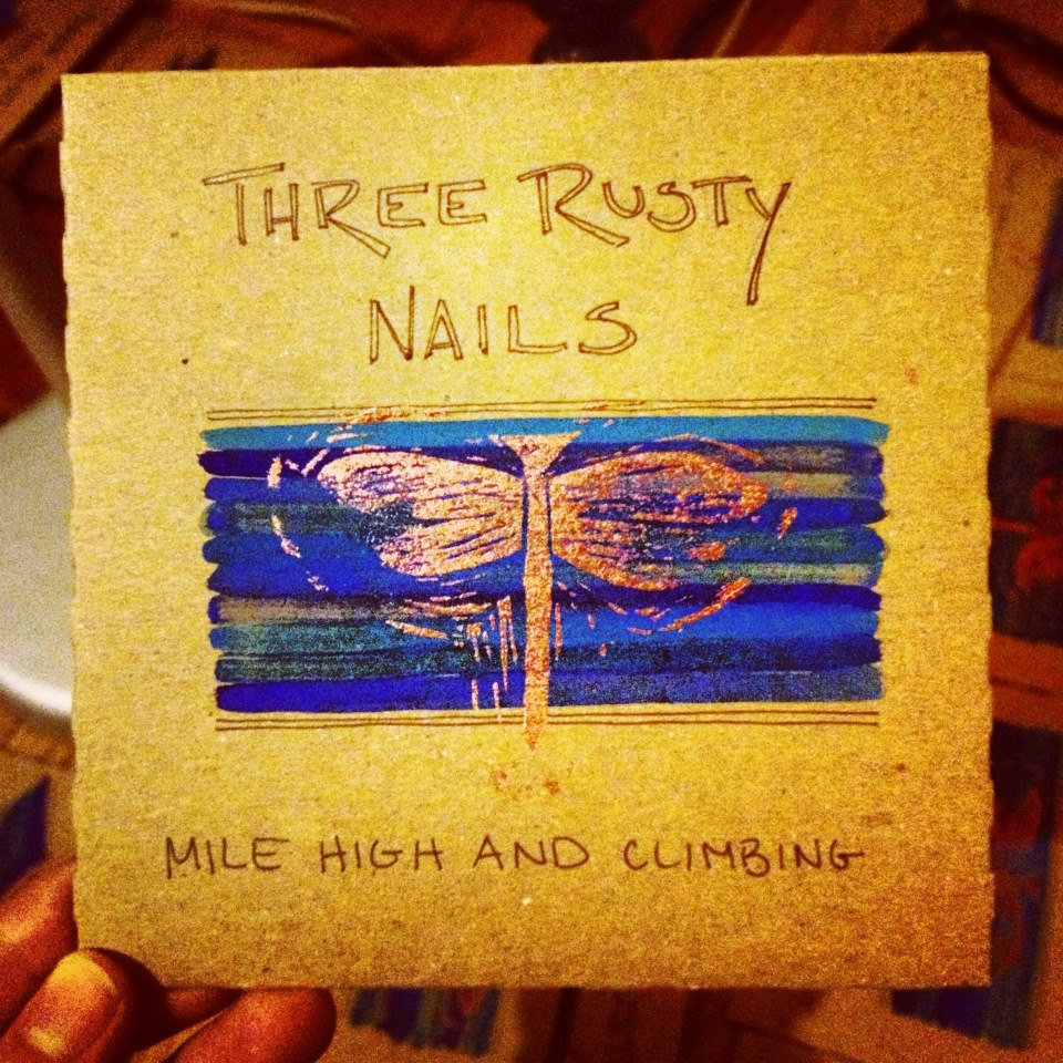 Mile High and Climbing | Three Rusty Nails