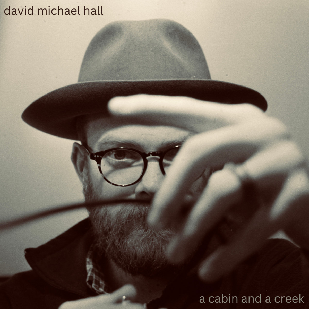 a cabin and a creek | David Michael Hall